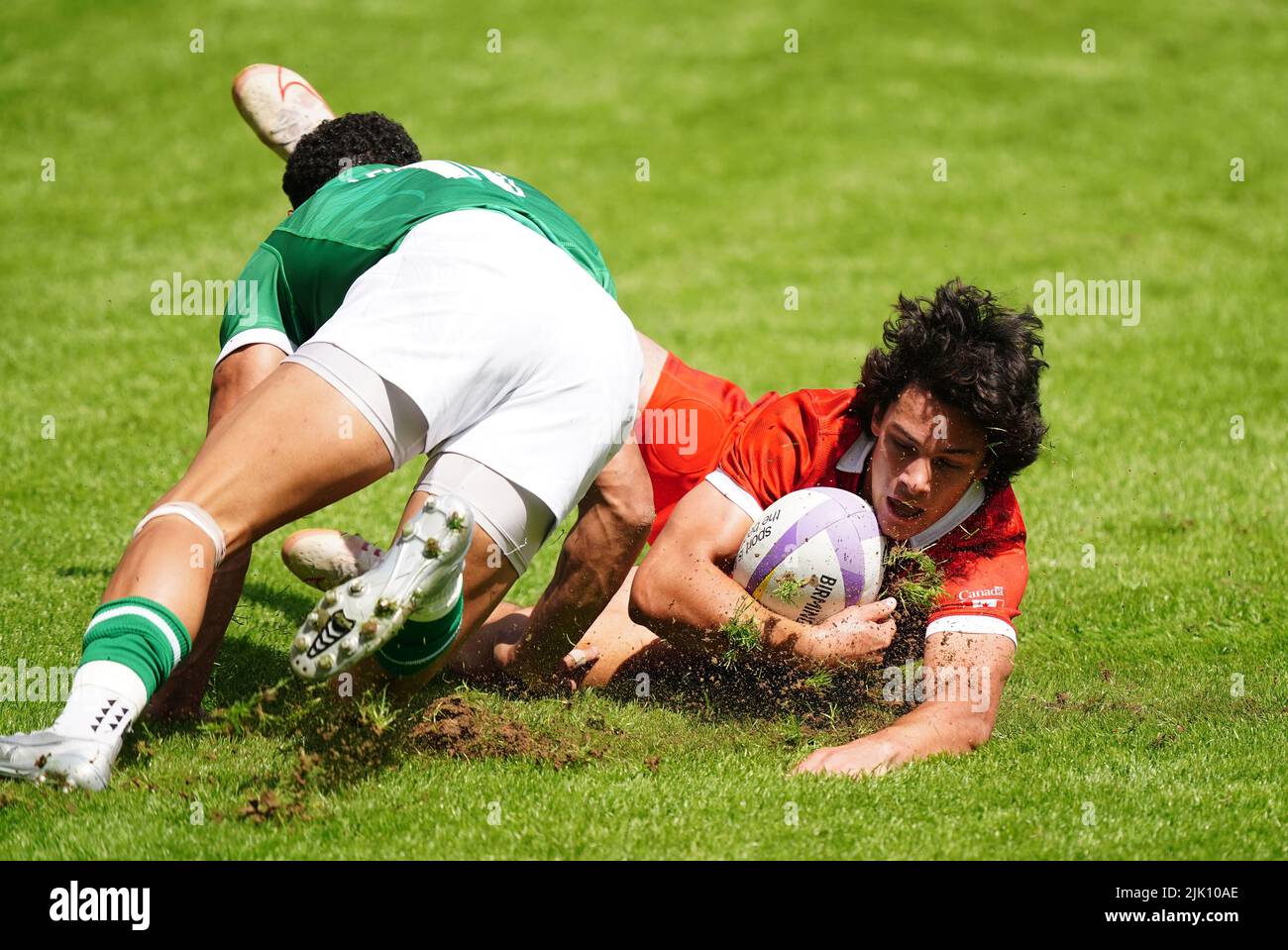 Canada's Brock Webster (right) is tackled by Wales' Lloyd Lewis during ...