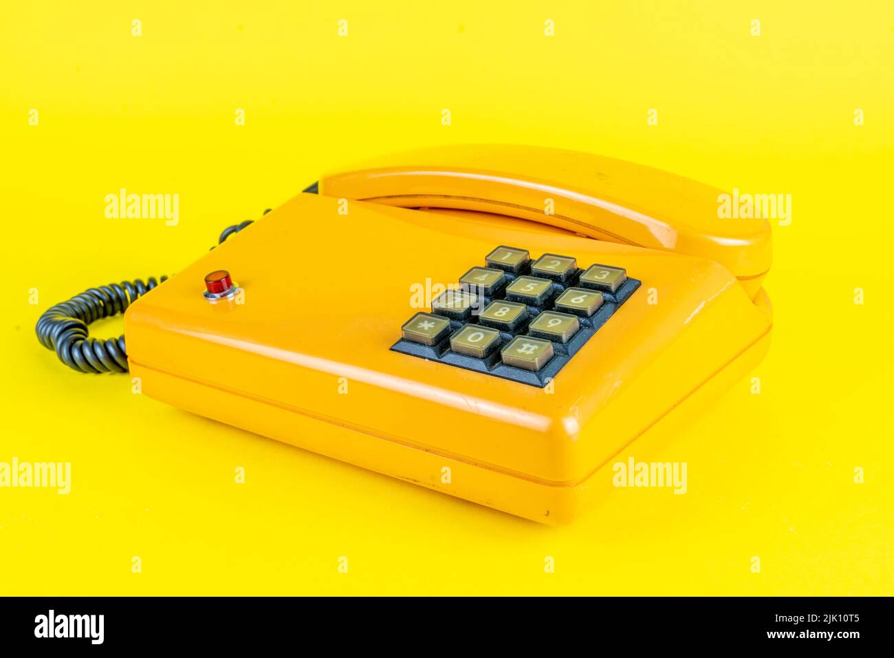 Old fashioned yellow rotary telephone hi-res stock photography and ...