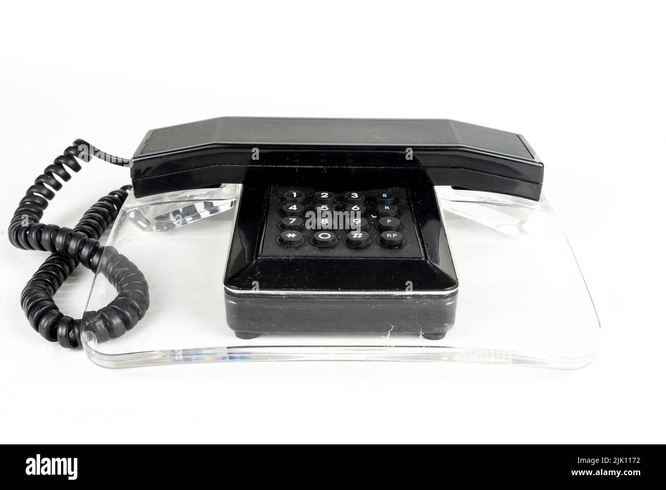 black and transparent vintage telephone over a white background Stock ...