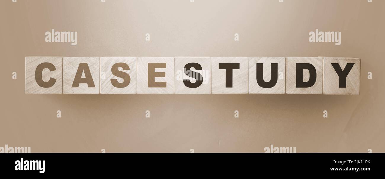Case Study written on a wooden cubes. Examples in business and ...