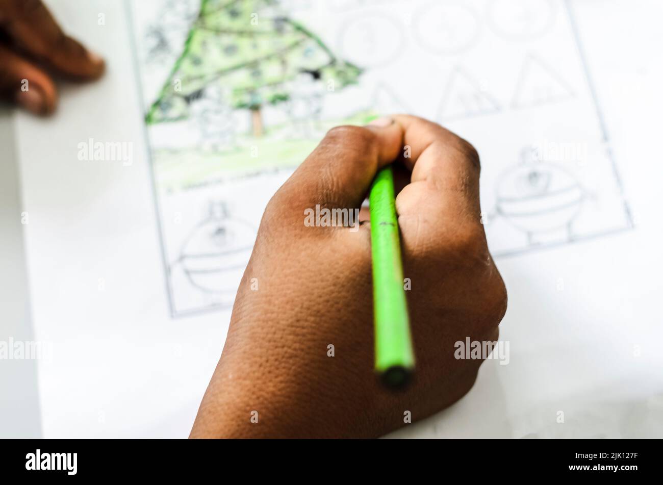 Child drawing with green color pen hi-res stock photography and images ...