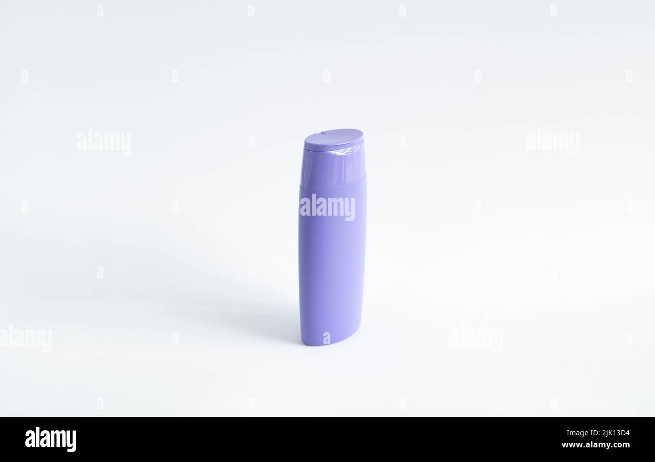 Violet plastic bottle of body care and beauty products. Studio ...