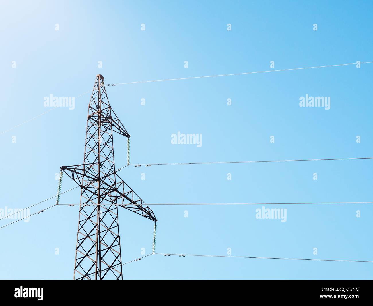 Metal beam electric pole with wires against the sky. Bottom view Stock ...