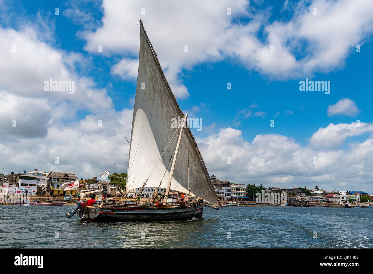 Traditional dhow sailing in the Indian Ocean, island of Lamu, Kenya ...