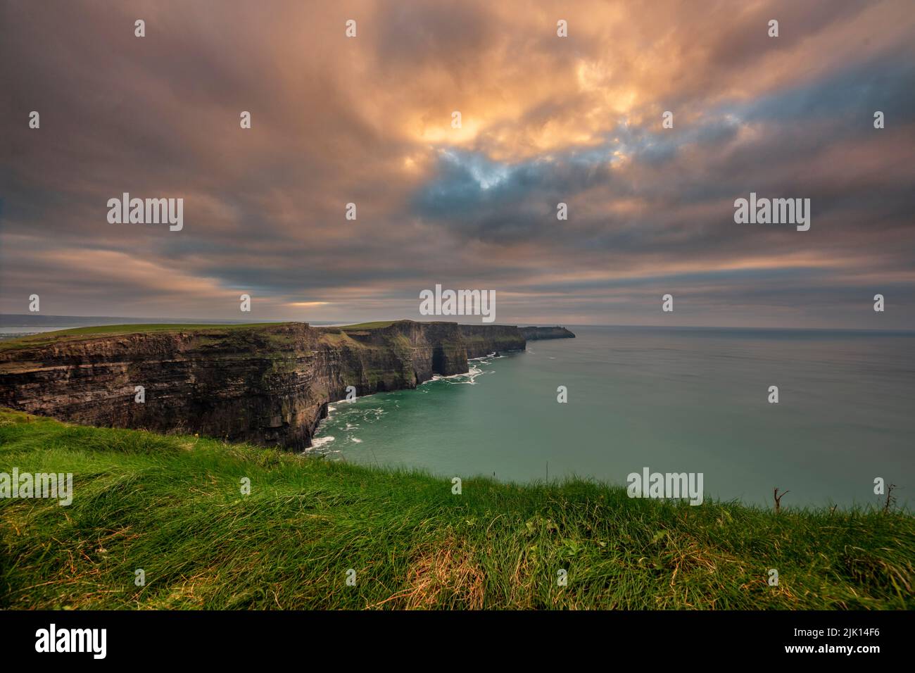 A scenic view of a beautiful seascape in a colorful sunset sky ...