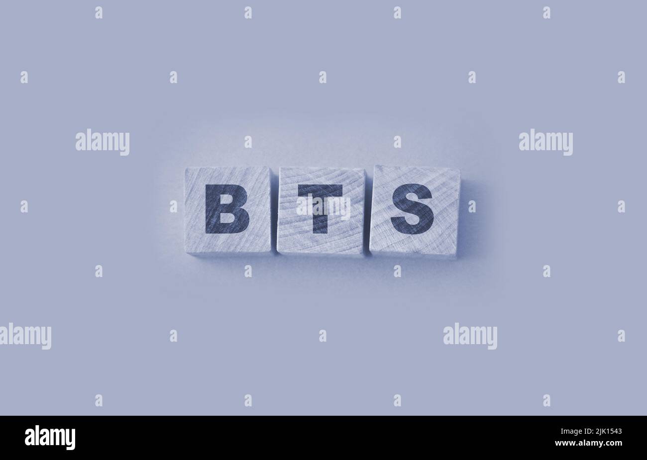 BTS letters on wooden cubes on yellow background. Business tourism ...
