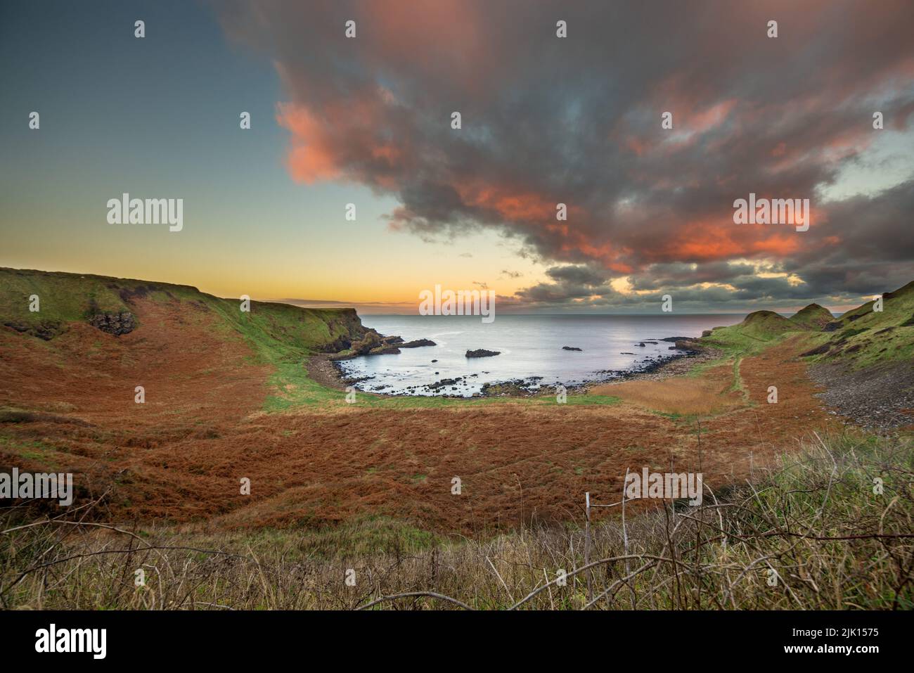 A scenic view of a beautiful seascape in a colorful sunset sky ...