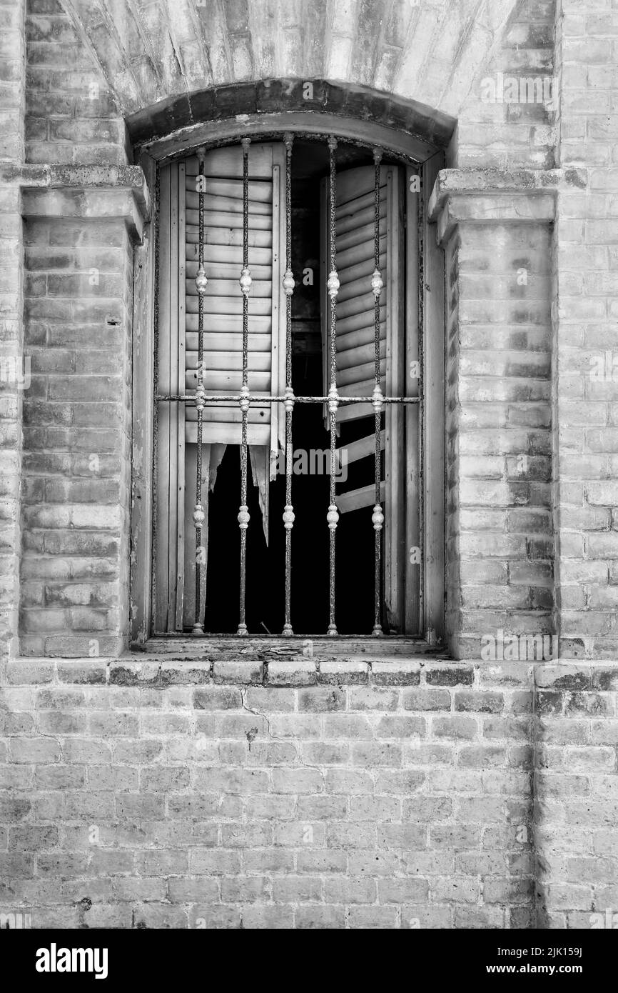 Broken and damaged window in an old house in Spain Stock Photo - Alamy