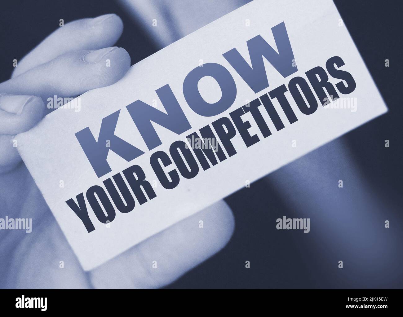 Businessman putting a card with text know your competitors. Business ...