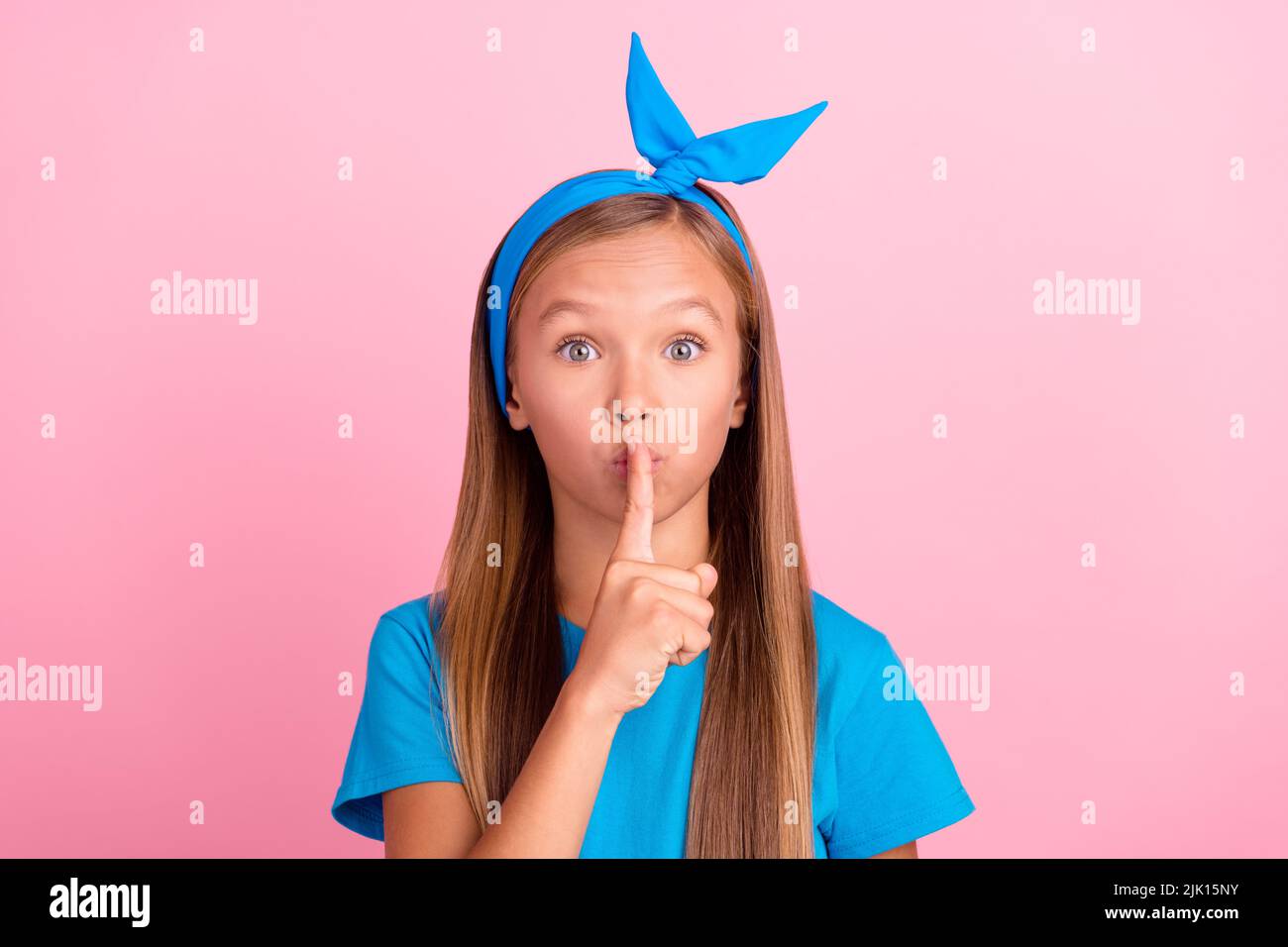 Portrait of little person finger touch cover lips demonstrate shh ...