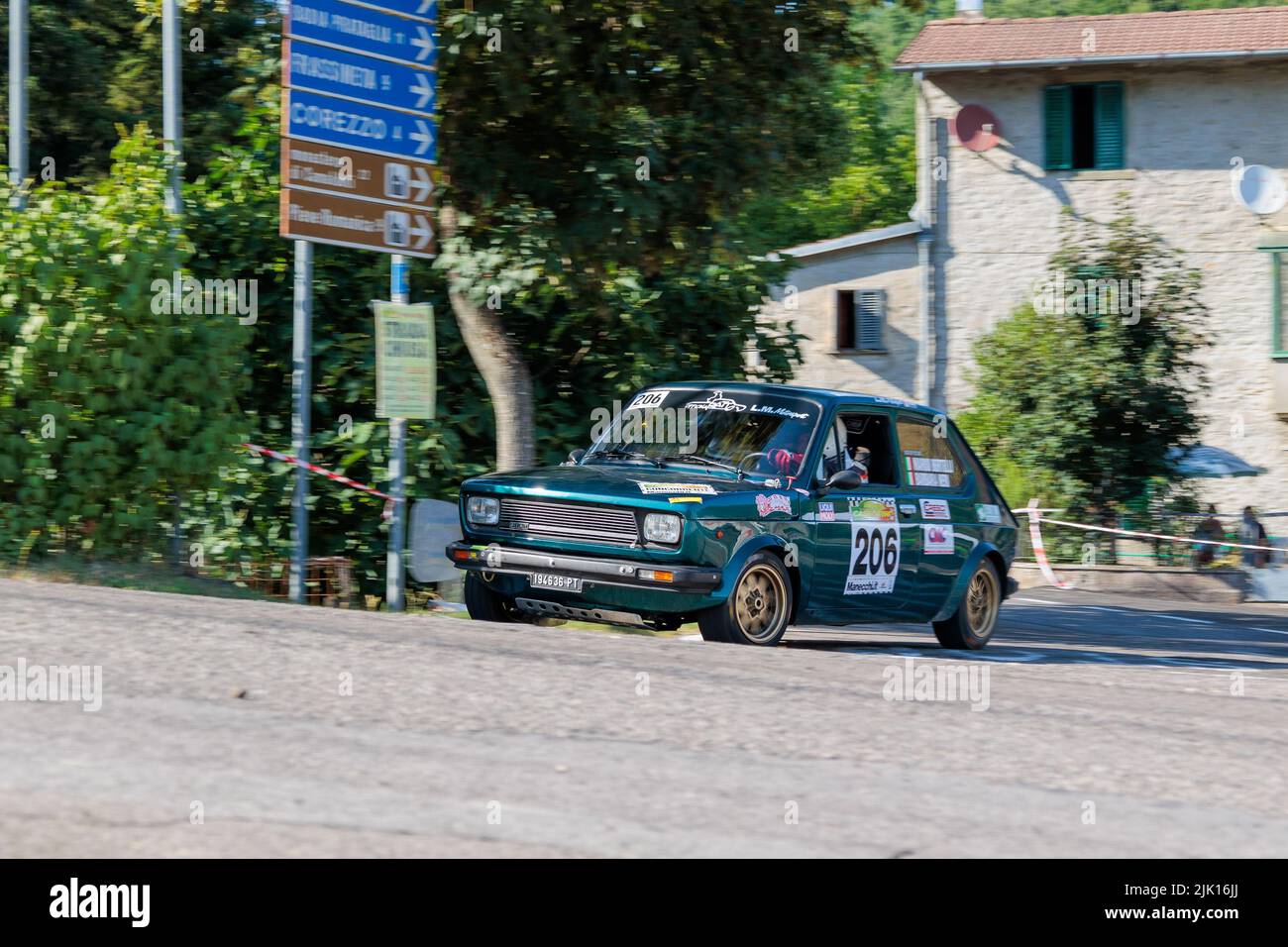 A blue Rally car 42 Rally Internazionale Casentino on a road with blur ...