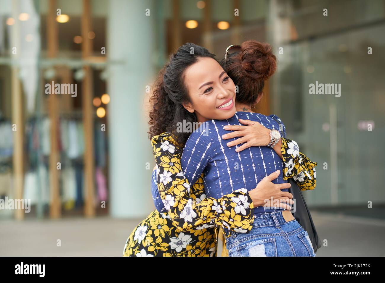 Vietnamese woman is happy to meet her friend Stock Photo - Alamy