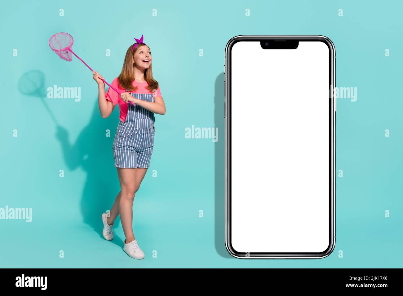 Full body portrait of excited carefree girl hold bug net look empty ...