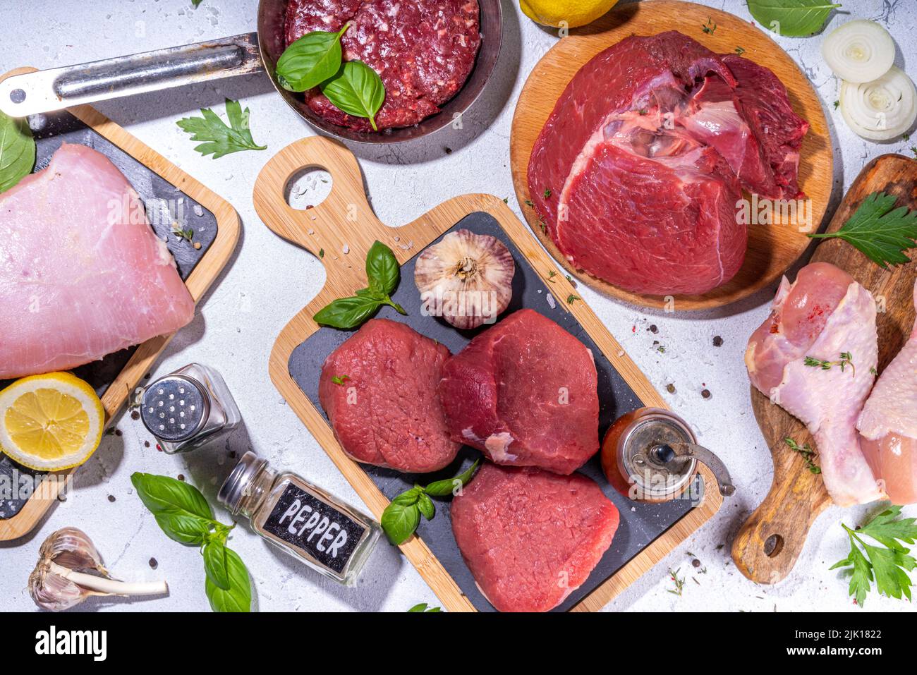 Various meat cooking background. Variety of red and white meat, patty ...