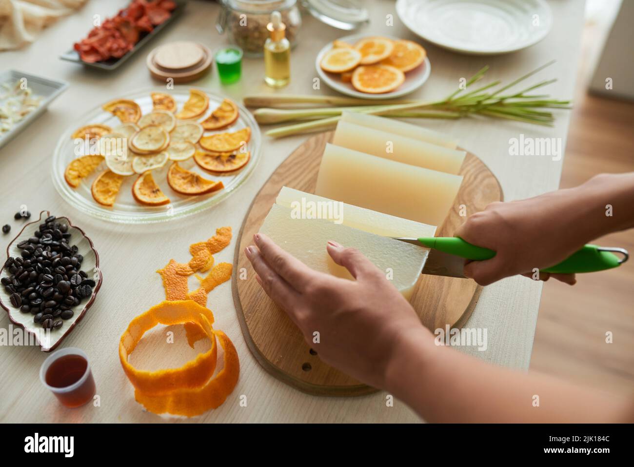 Woman cutting soap base to mix it with other ingredients Stock Photo ...