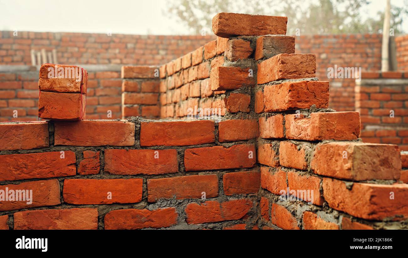 New red brick wall. Red brick wall with contrasty sunlight. building ...