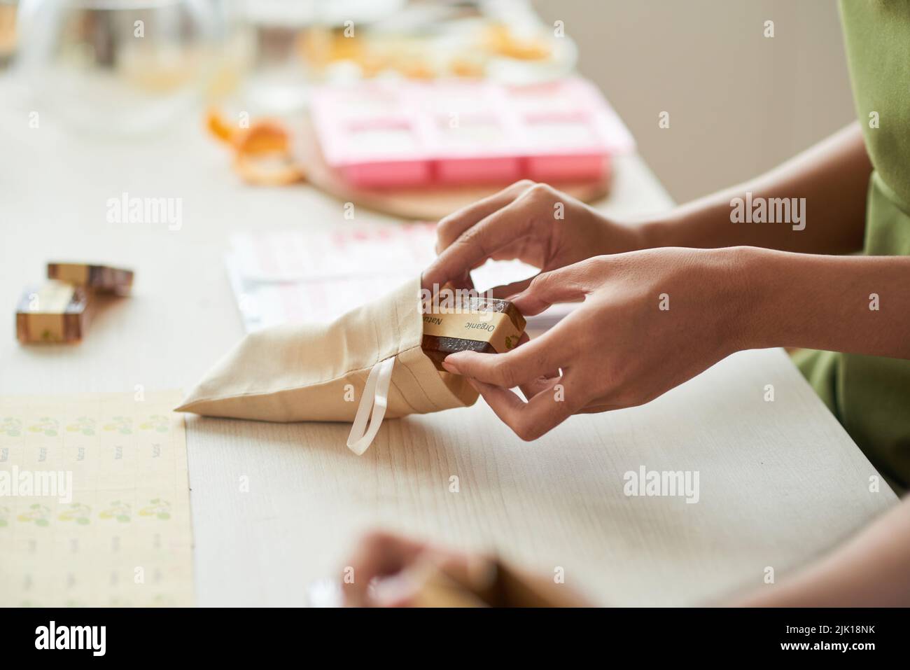 Woman preparing soap bars for selling in her studio Stock Photo - Alamy