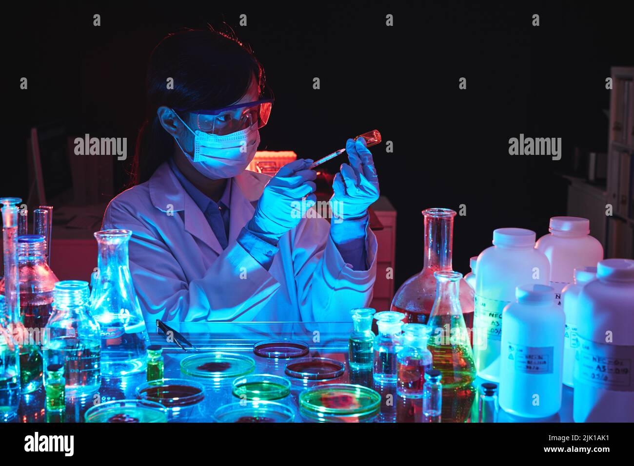 Female chemist working on new medicine Stock Photo - Alamy