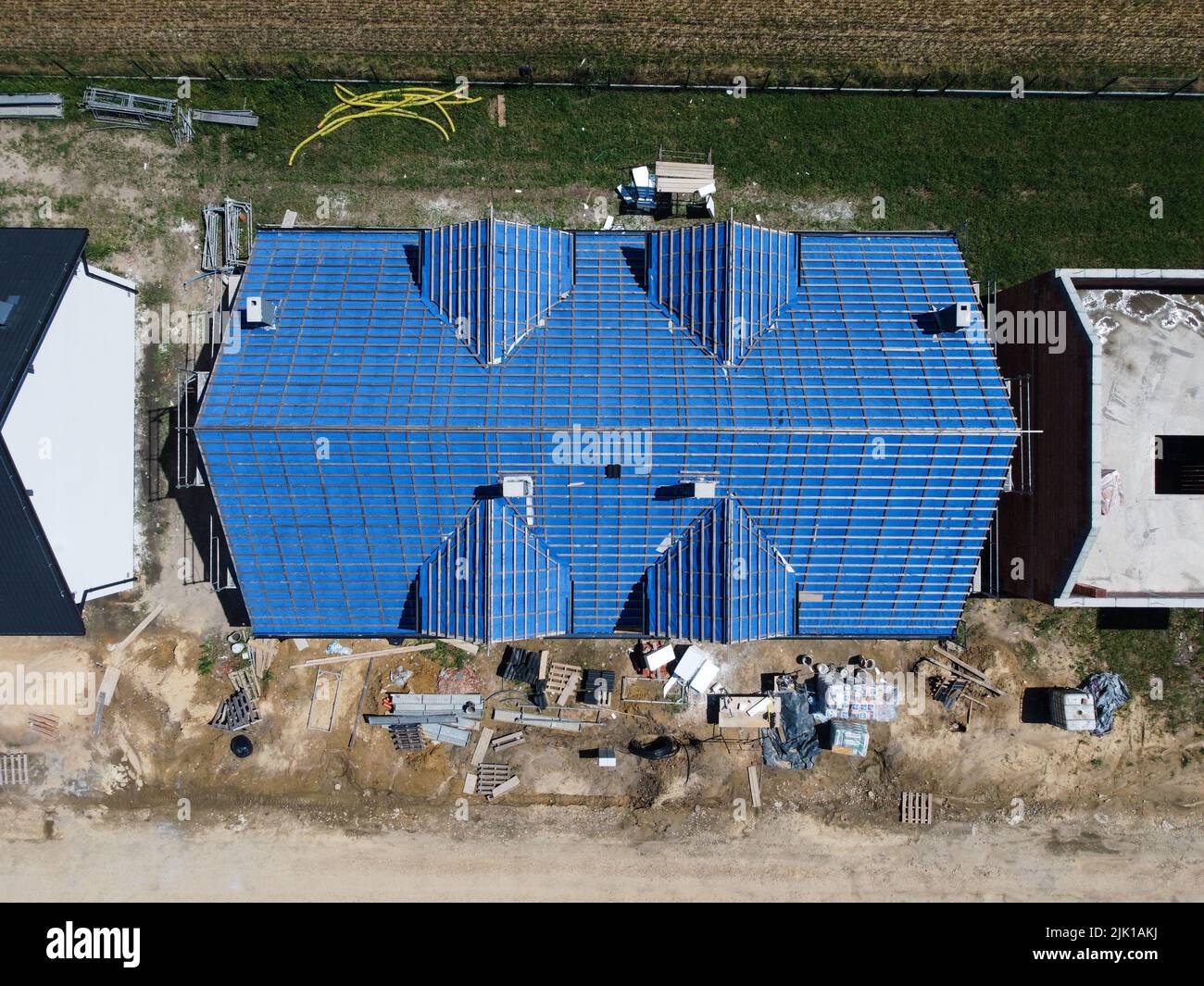An aerial view of blue construction site roofs on rural area Stock ...