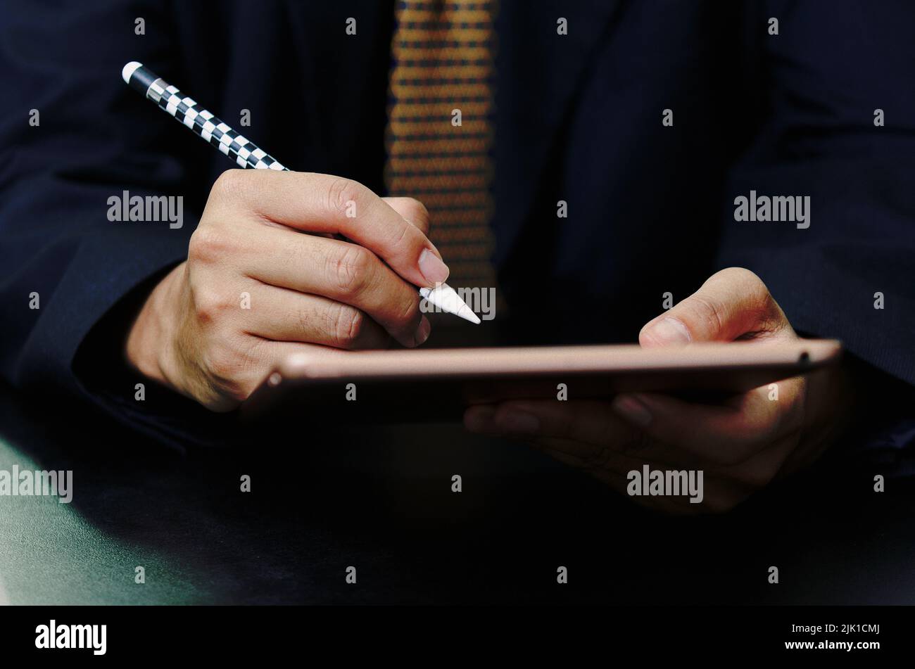 Business man sign digital online tablet contract in application on desk ...