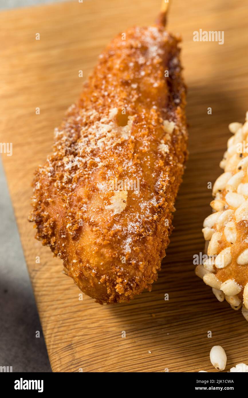 Homemade Fried Korean Corn Dog with Potatoes and Rice Toppings Stock ...