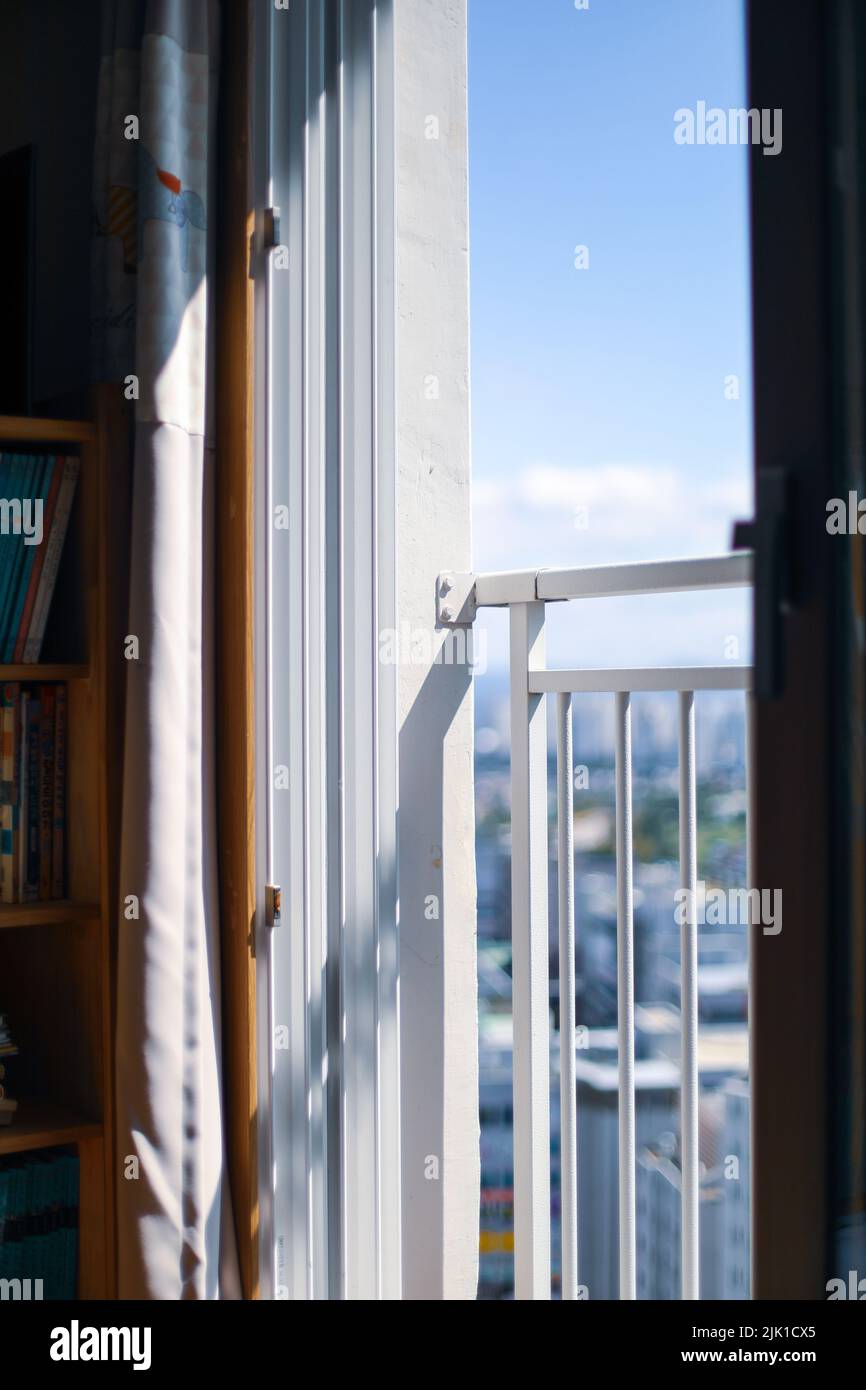 A vertical shot of an opened window from inside the Seoul building in ...