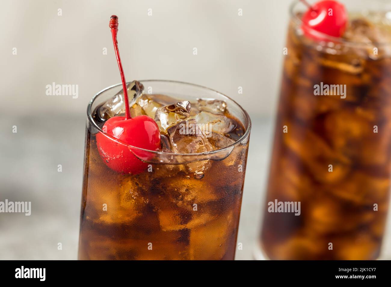 Cold Refreshing Cherry Cola Soda with a Straw Stock Photo - Alamy