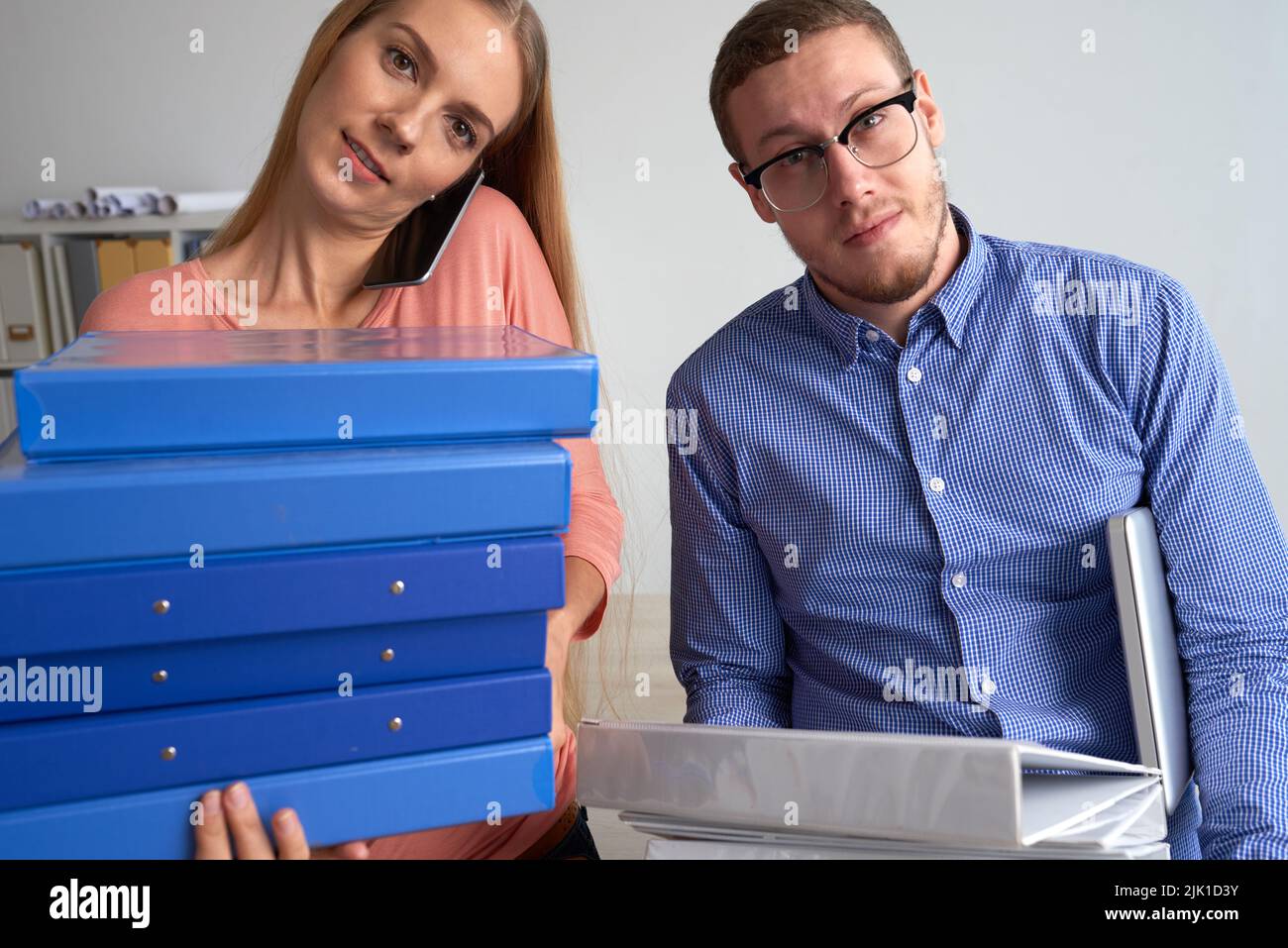 Young businessman stack folders hi-res stock photography and images - Alamy