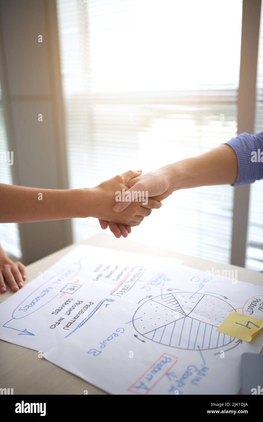 Business partners shaking hands after having presentation Stock Photo ...