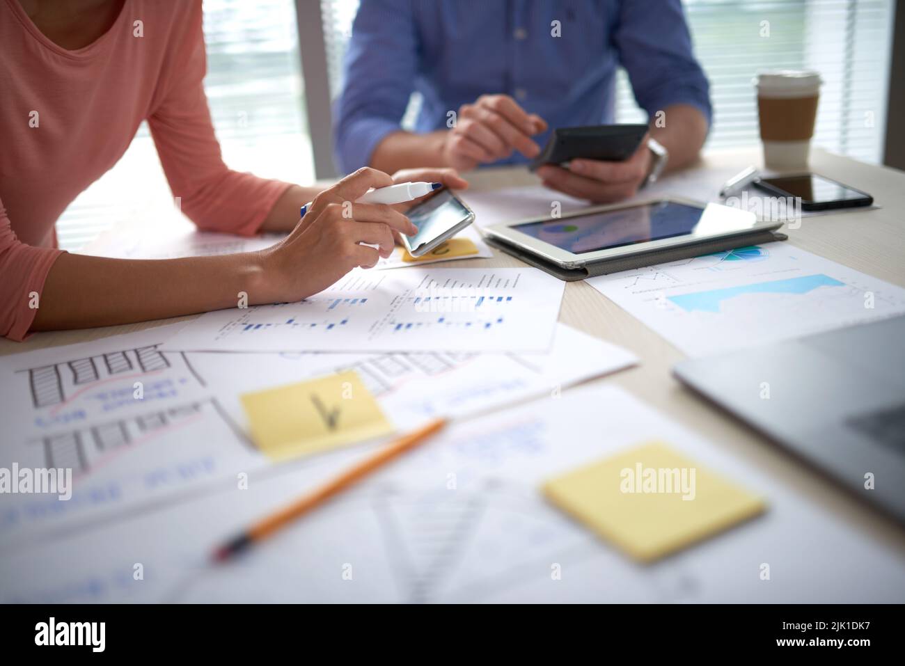 Business people working on financial documents for business ...