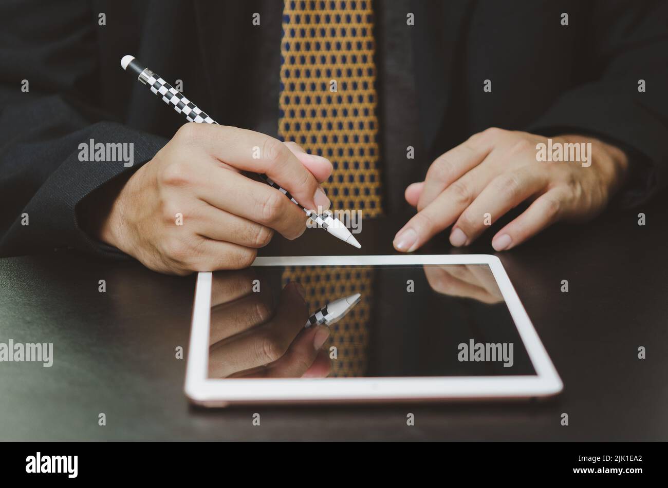 Business man sign digital online tablet contract in application on desk ...