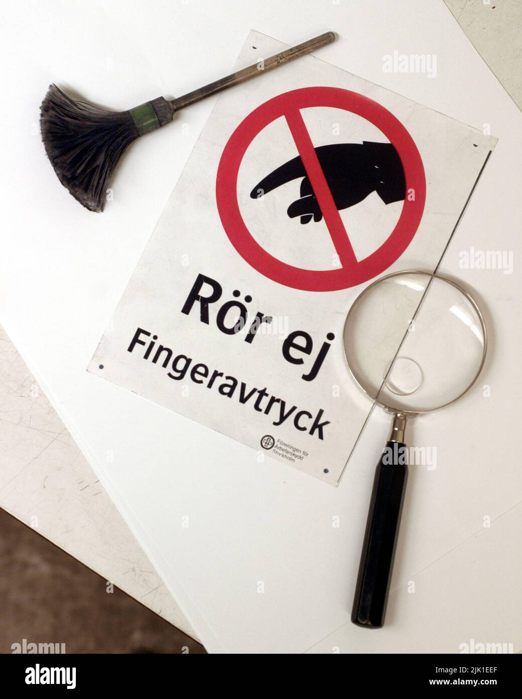 Magnifying glass and brush at a police laboratory Stock Photo - Alamy