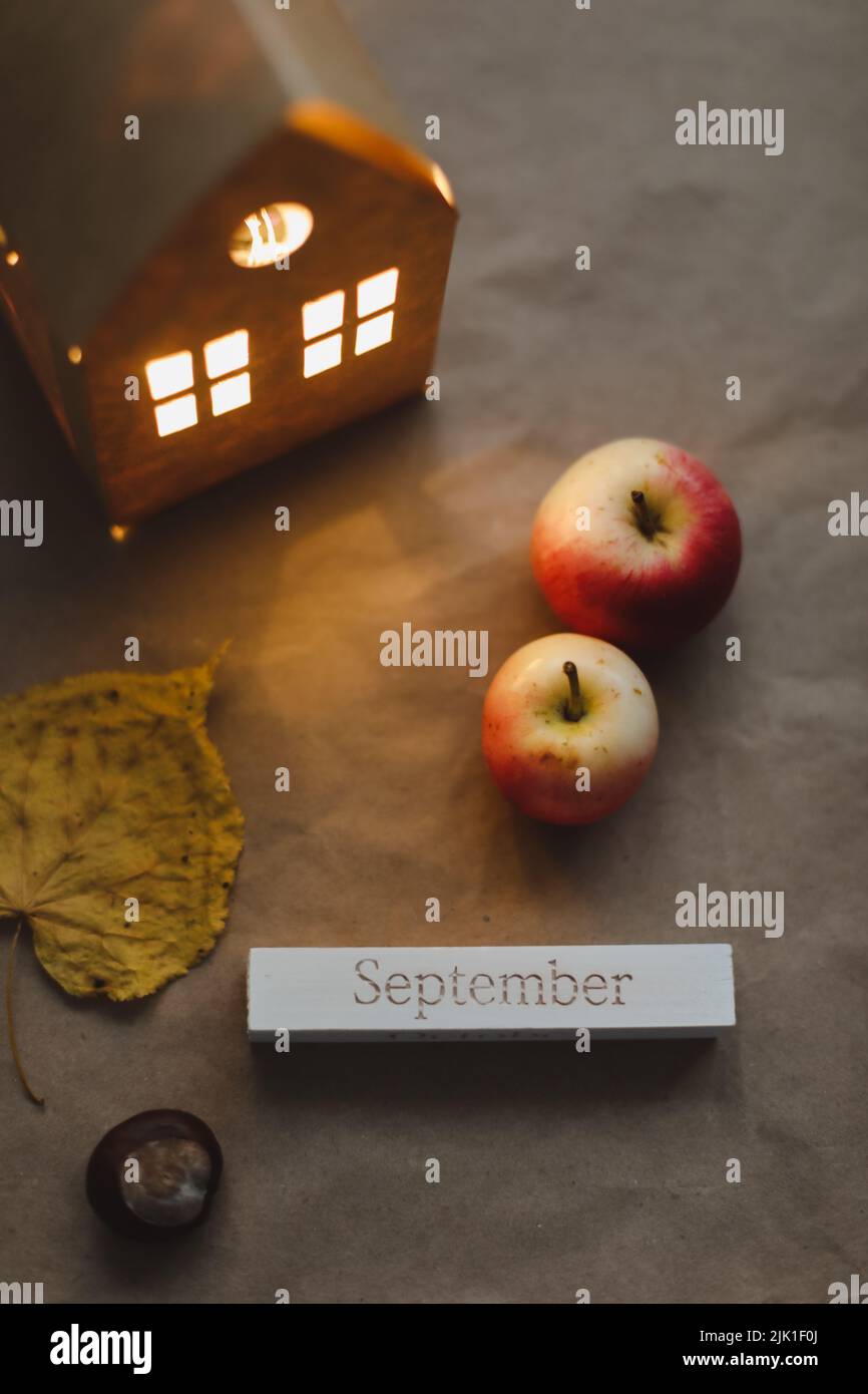 hello september. autumn card with fresh red apples on white background ...