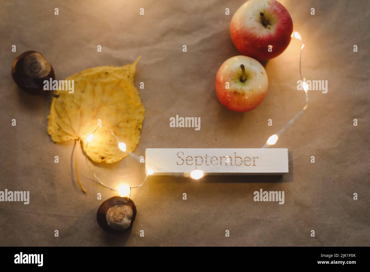 hello september. autumn card with fresh red apples on white background ...