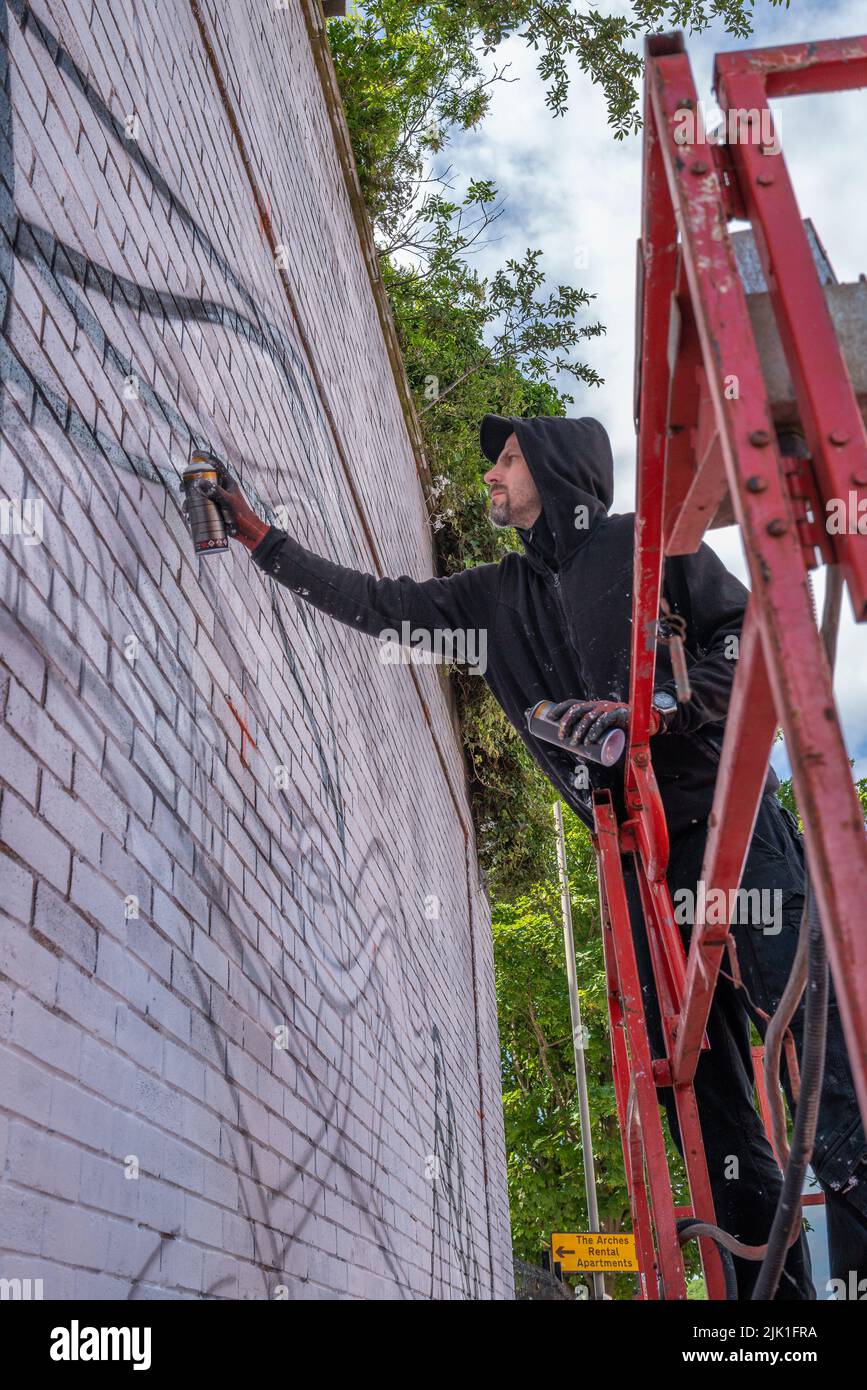 A graffiti arist in Leicester Graffiti Festival 2022 Stock Photo - Alamy