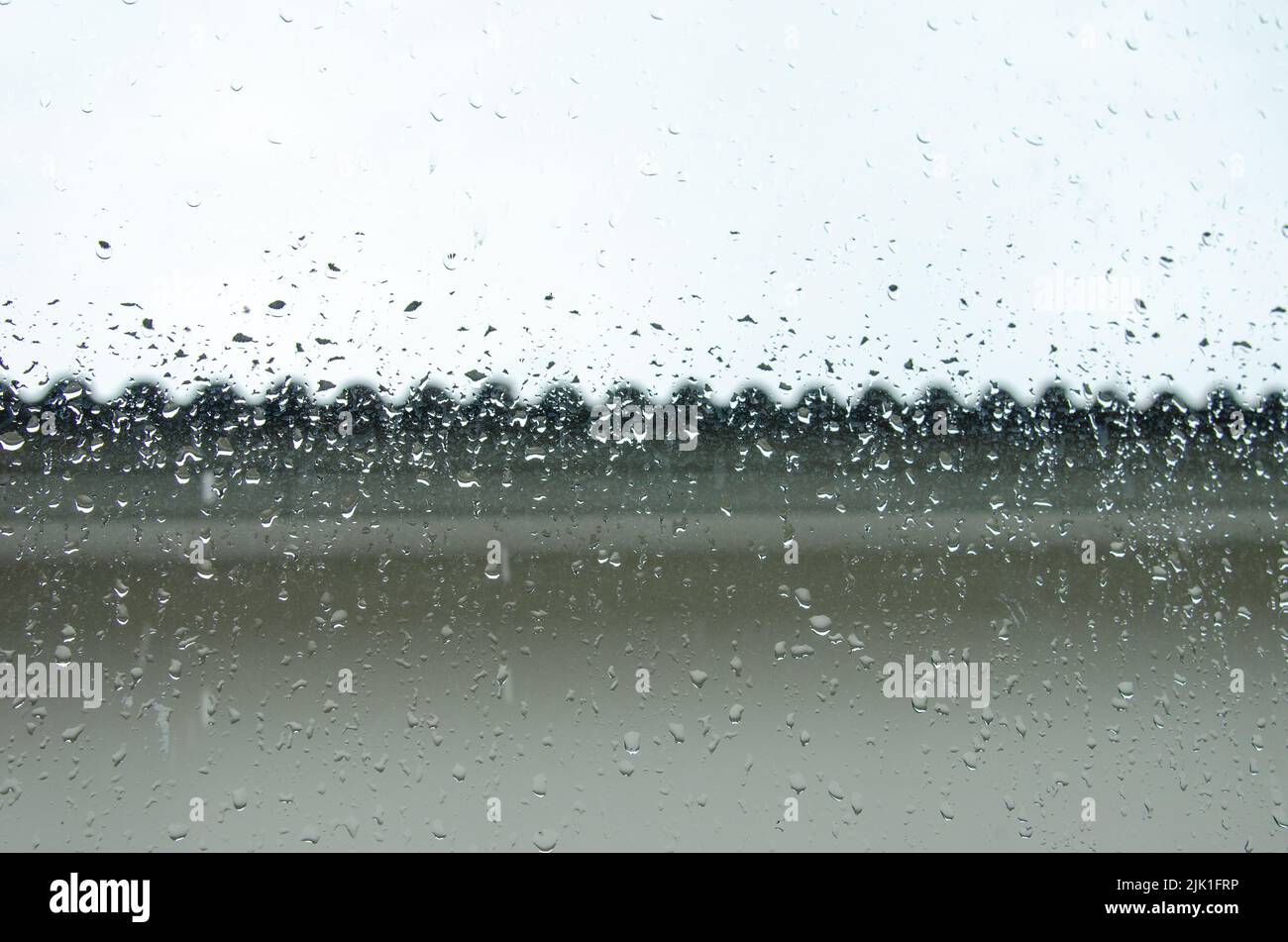 raindrops on the window of the house background Stock Photo - Alamy