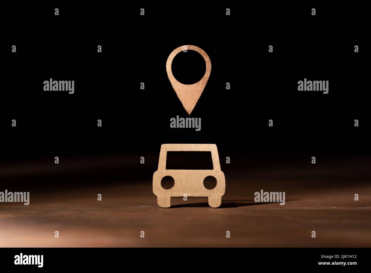 Cardboard representation of a car with the symbol of position on the ...