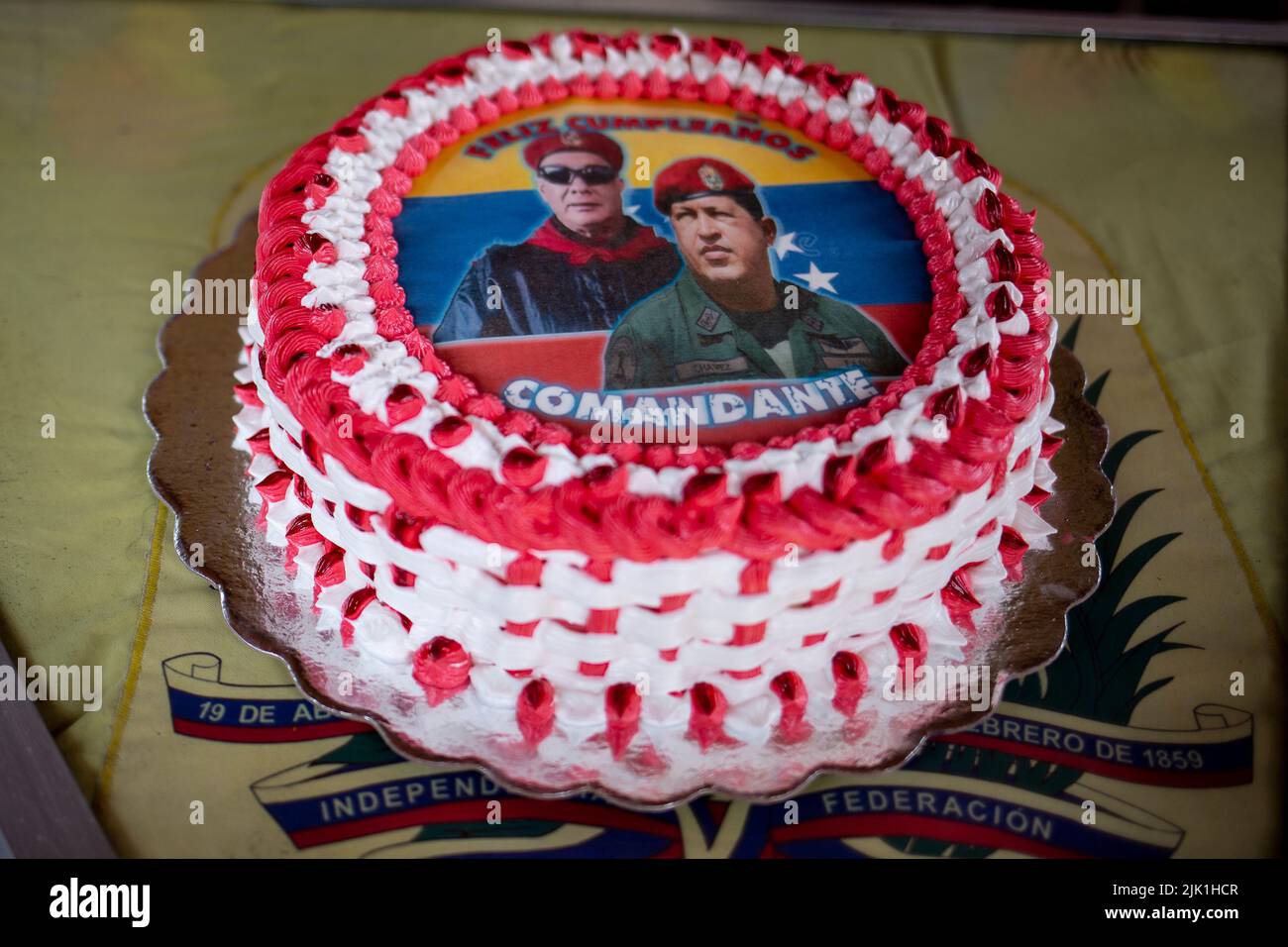 Caracas, Venezuela. 28th July, 2022. A cake with the image of the late ...