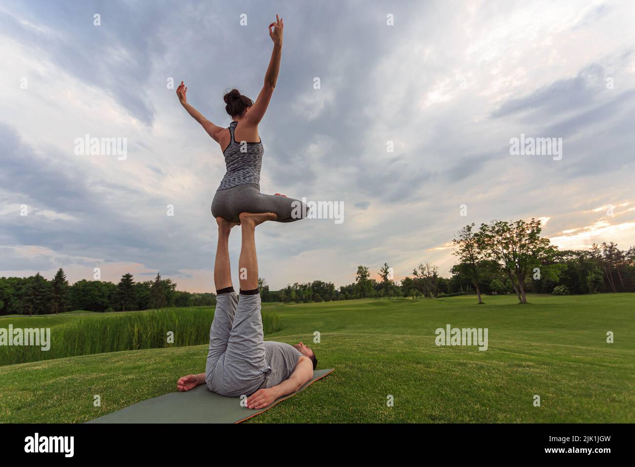 Strong acrobatic woman lifting man hi-res stock photography and images ...