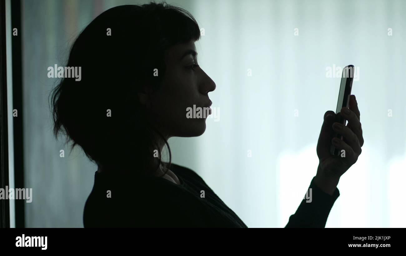 Person holding phone home silhouette hi-res stock photography and ...