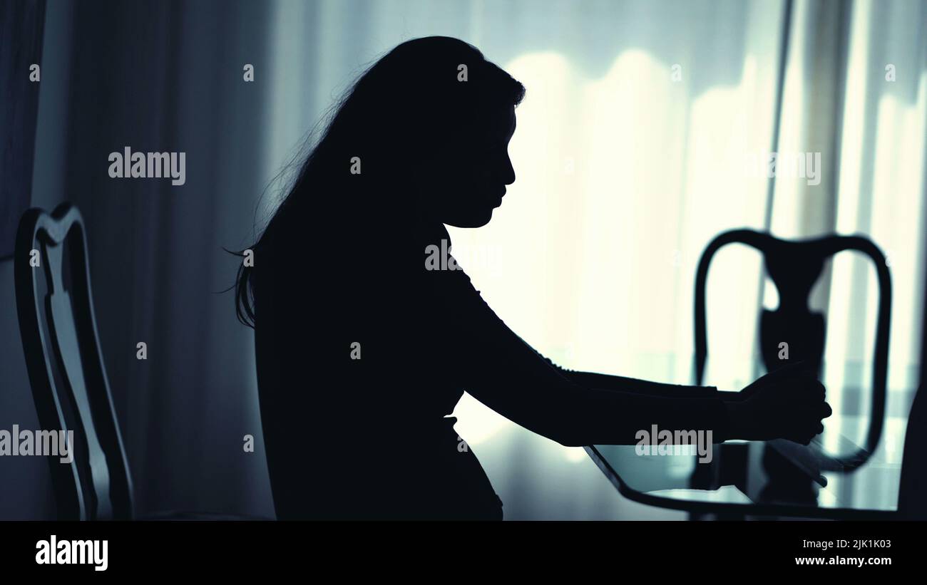 Worried pensive woman suffering at home remembering trauma. Person with ...