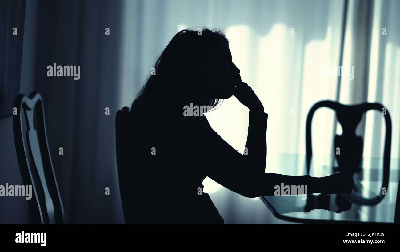 Worried pensive woman suffering at home remembering trauma. Person with ...