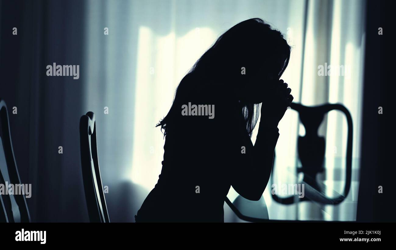 Worried pensive woman suffering at home remembering trauma. Person with ...