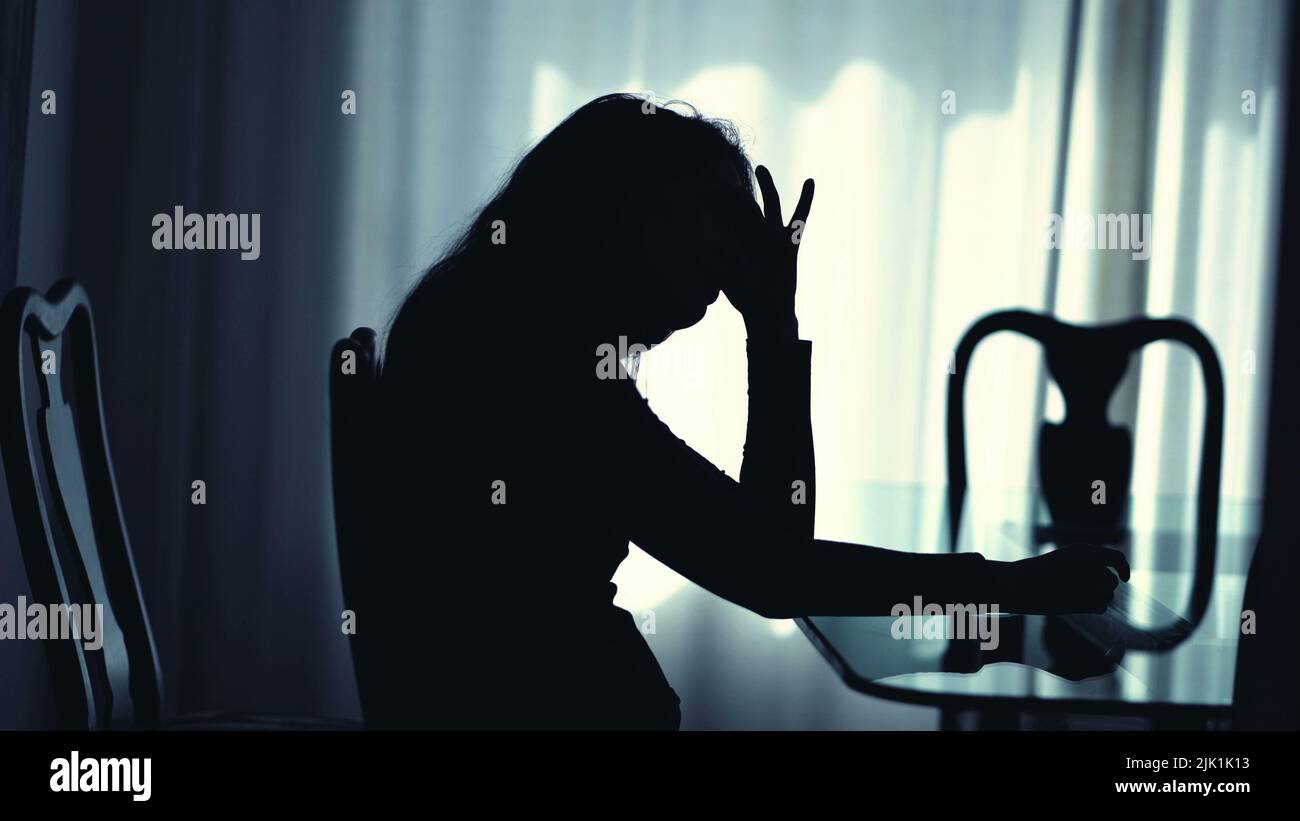 Worried pensive woman suffering at home remembering trauma. Person with ...