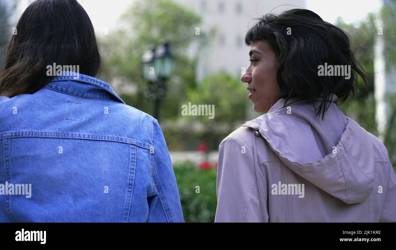 Two People Talking Outside