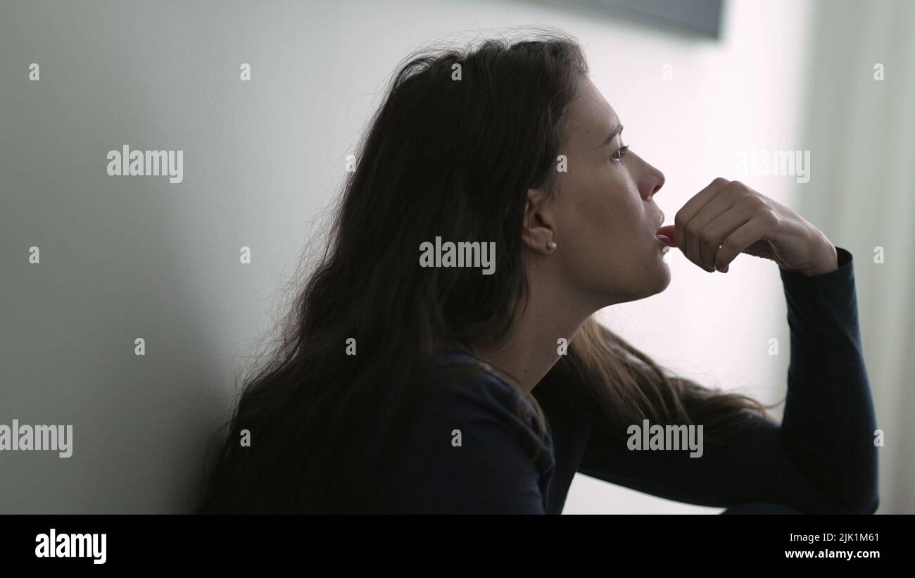 Nervous woman suffering from depression sitting on floor. Frustrated ...
