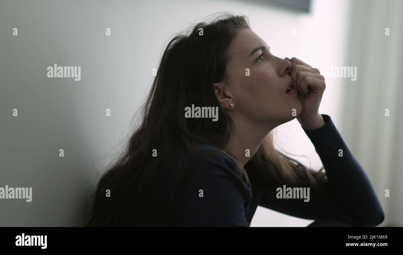 Nervous woman suffering from depression sitting on floor. Frustrated ...