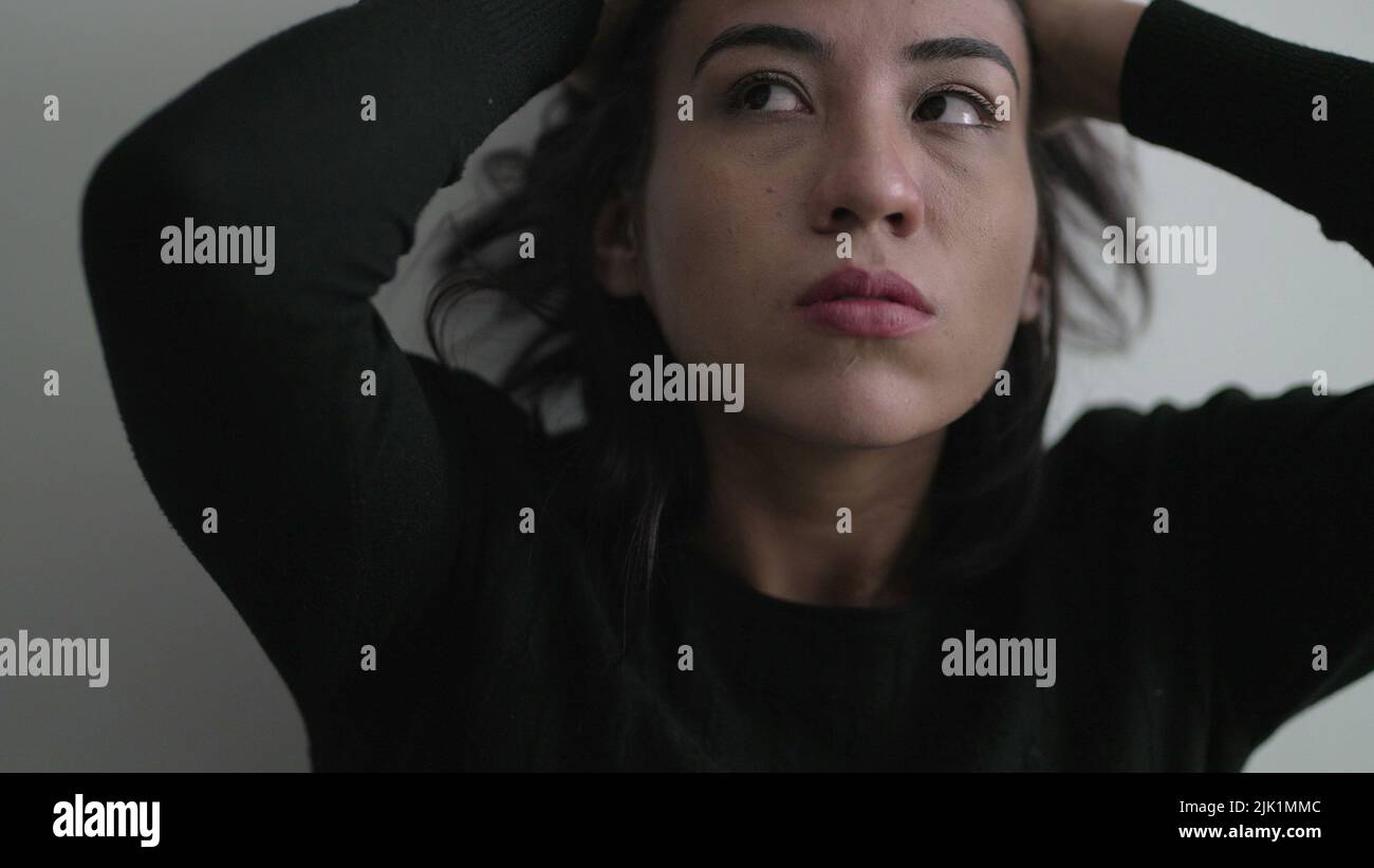 Close up woman face with frustrated emotion pondering solution to ...