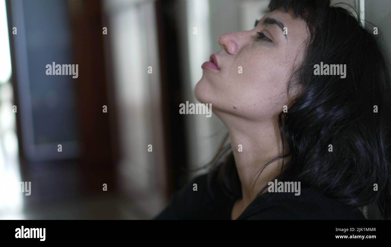Closeup of young woman face feeling regret. Person taking deep breath ...