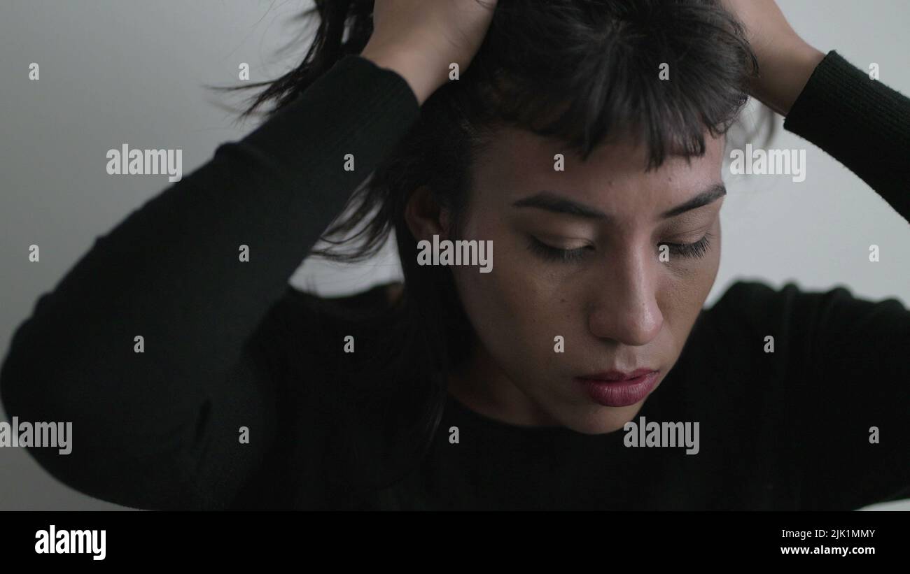 Close up woman face with frustrated emotion pondering solution to ...